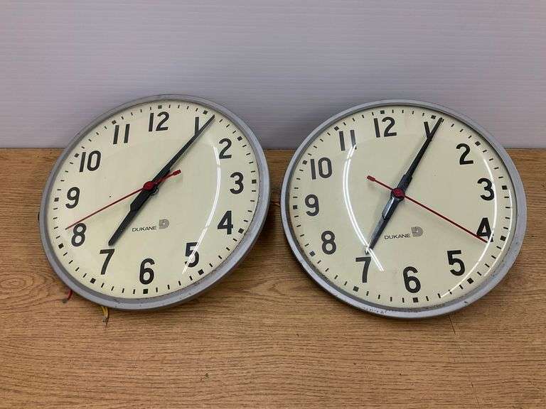 Lot of 2 Dukane Wall Clocks - 13 in. dia. - Beloit Auction & Realty