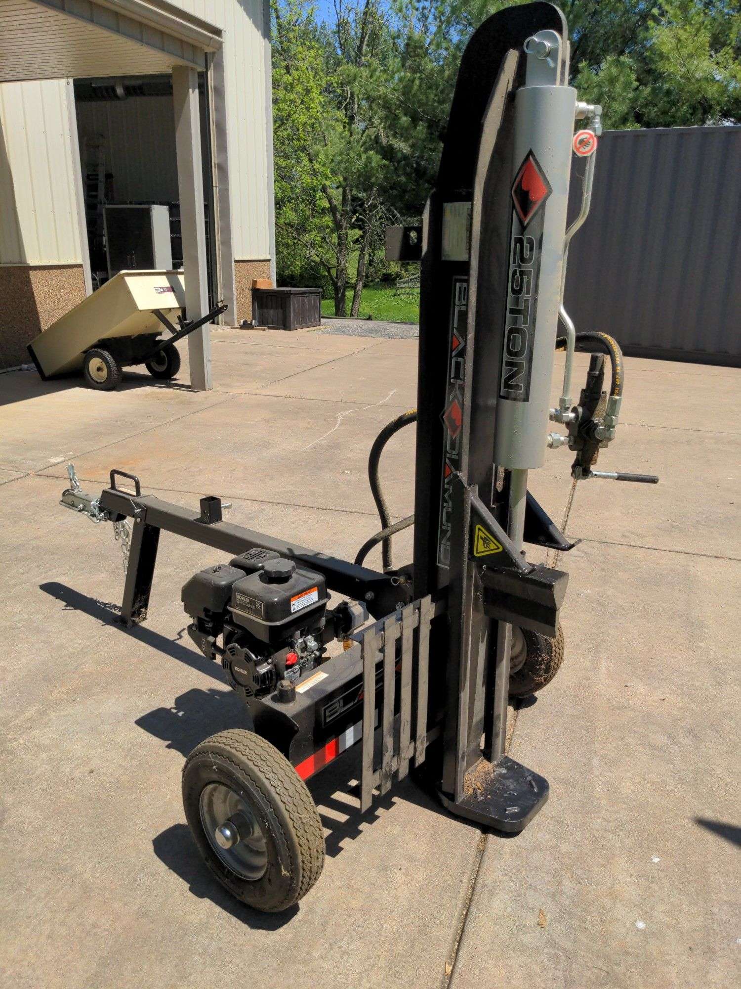 Black diamond 25 ton log splitter with a 196cc Kohler maximum log length 26 in Aumann Auctions Inc