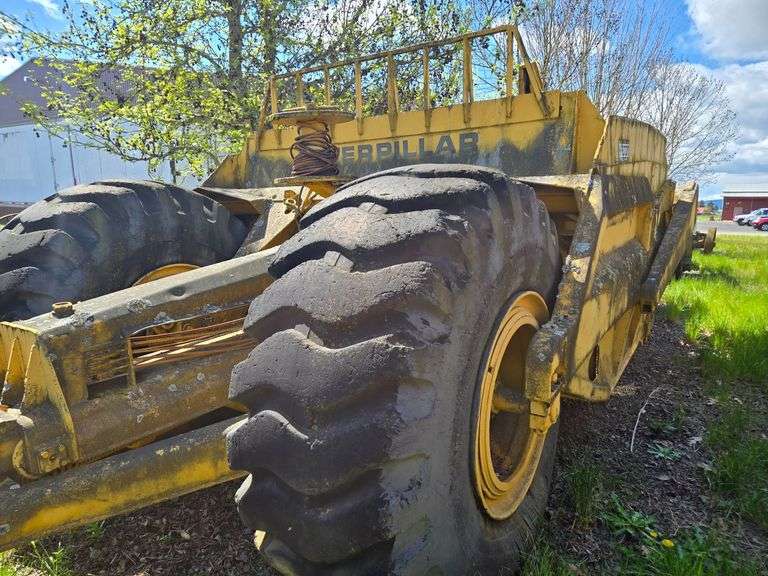 Caterpillar 463 pull scraper - Aumann Auctions, Inc.