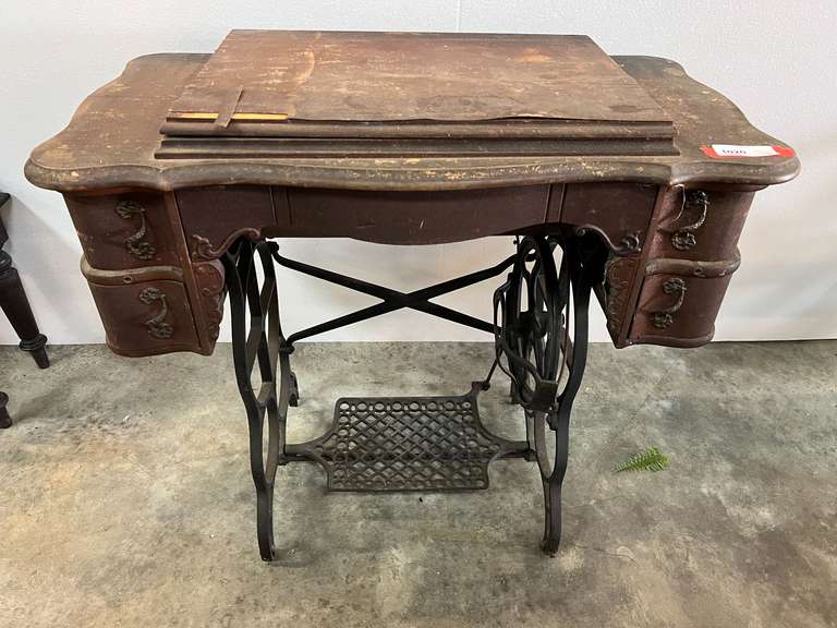 Antique Davis treadle sewing machine, with five drawer cabinet, the top ...