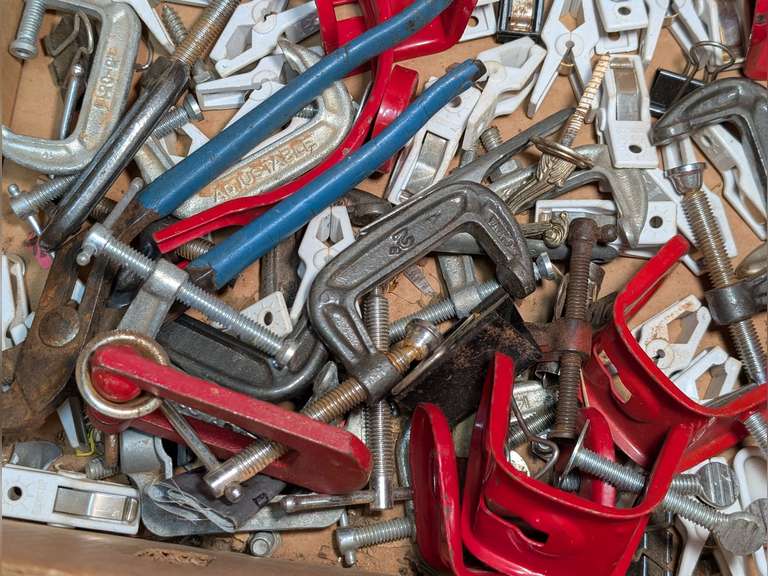 BOX FILLED WITH C-CLAMPS, SPRING-LOADED CLIPS, CHANNEL LOCKS, AND MORE ...