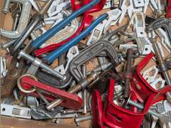 BOX FILLED WITH C-CLAMPS, SPRING-LOADED CLIPS, CHANNEL LOCKS, AND MORE ...