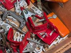 BOX FILLED WITH C-CLAMPS, SPRING-LOADED CLIPS, CHANNEL LOCKS, AND MORE ...