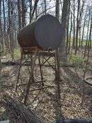 Large Metal Storage Tank on Stand - Ford Brothers, Inc.