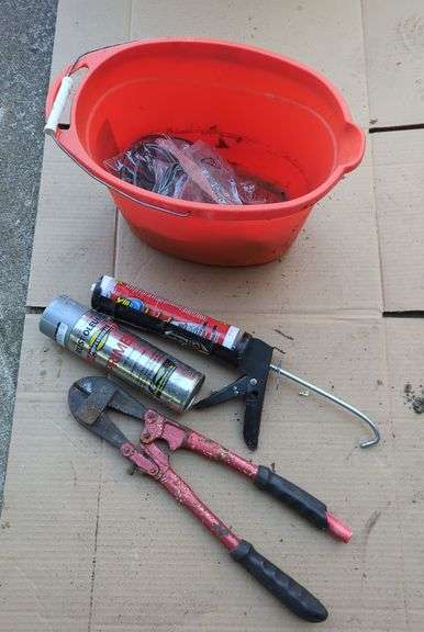 Red Bucket with Tools and Supplies: Bolt Cutters, Caulking Gun, Primer ...