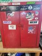 Red Metal Storage Cabinet with Stickers - Ford Brothers, Inc.