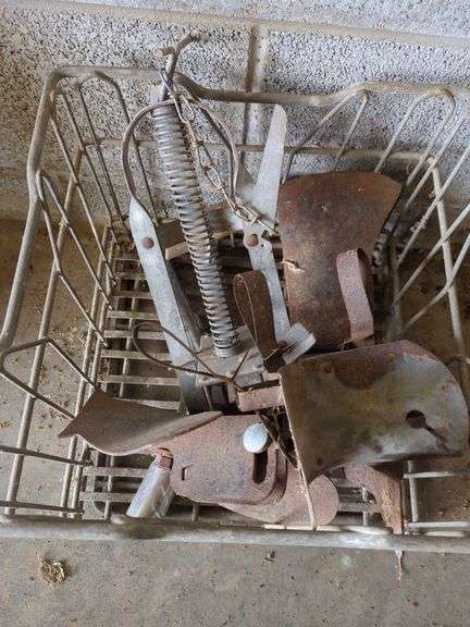 Assorted Metal Traps and Tools in Wire Basket - Ford Brothers, Inc.