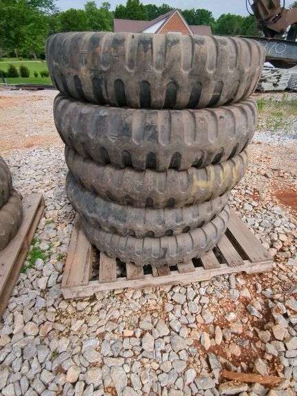 Stack of Five 11.00-20 Military Tires - Ford Brothers, Inc.
