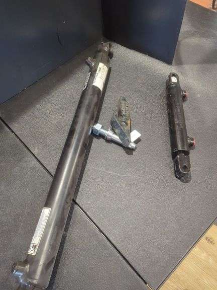 Two Hydraulic Cylinders and a Mounting Bracket - Ford Brothers, Inc.