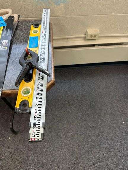 Measure Stick Level Clamp - Hostetter Auctioneers