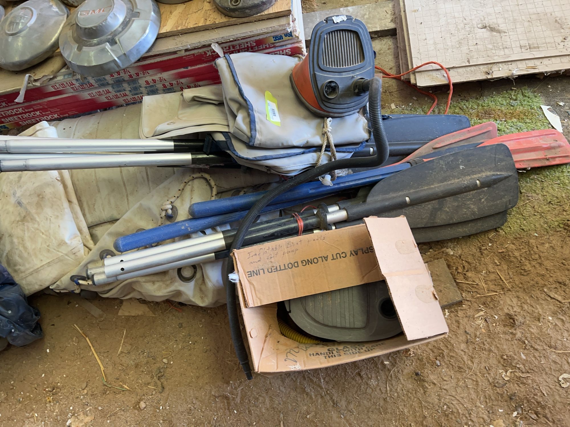 Various inflatable rafts and oars plus pumps