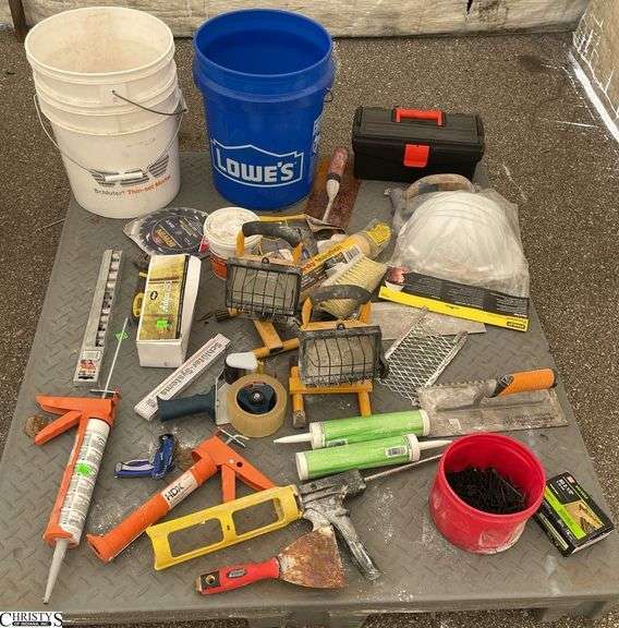 Skid of various tools, screws, caulking material, worksite lamps, 5 ...