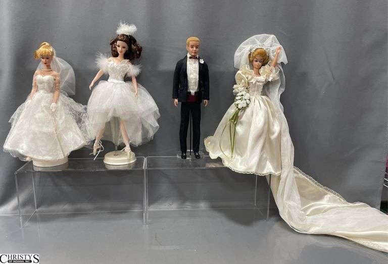4 Barbie Dolls on Stands. Includes 3 Barbies in Wedding Dresses and 1 Ken Doll in Black Tux ...