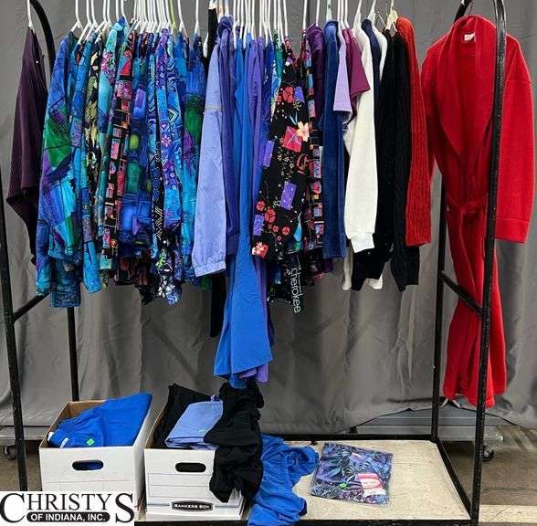 Rack of Nurse Scrubs, Jackets, Sweaters, and a Robe (Rack Not Included ...